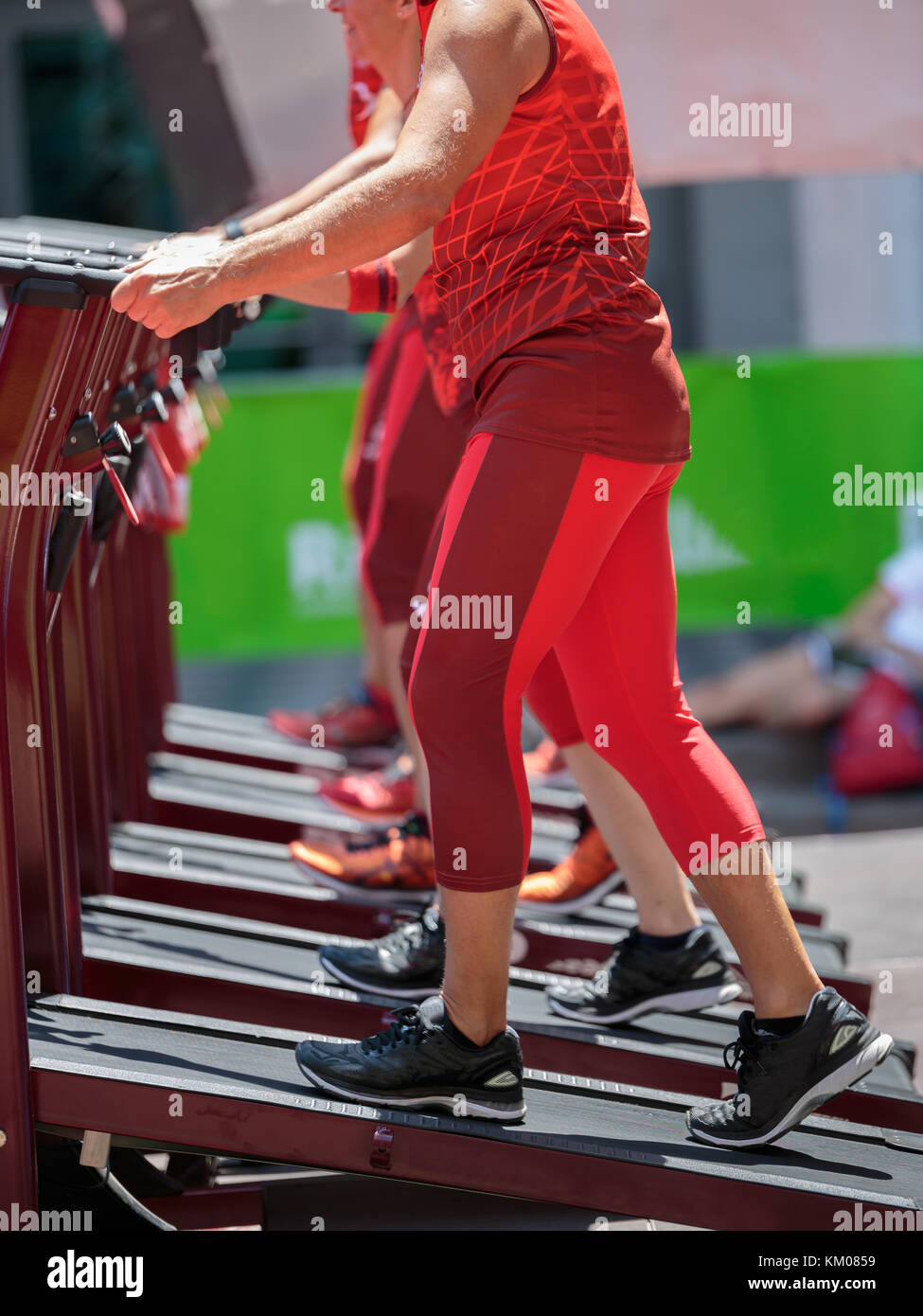 Athletic People Exercising Outdoor on Running Machines Stock Photo - Alamy