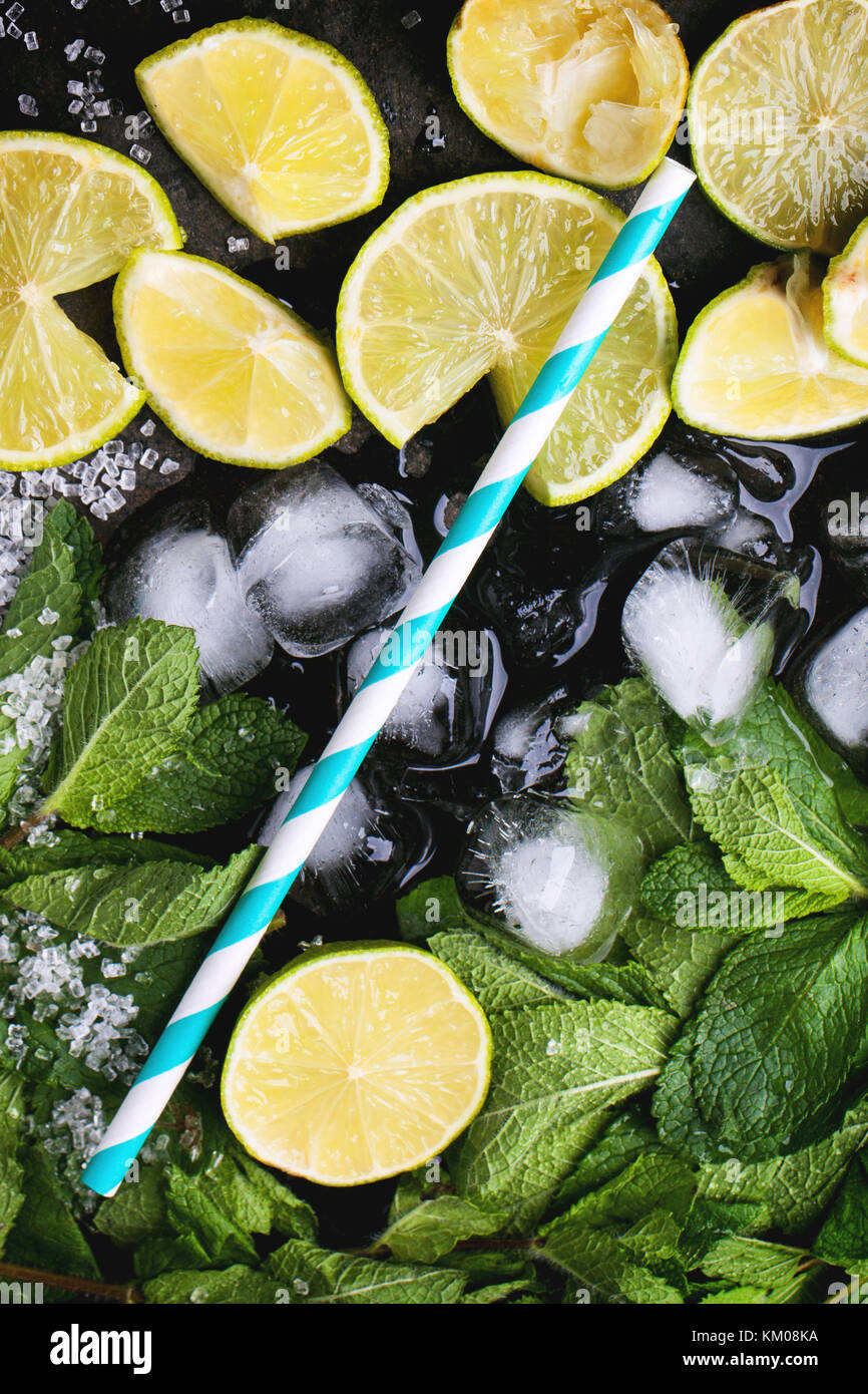 Ingredients for mojito (fresh mint, limes, ice, sugar) with retro ...