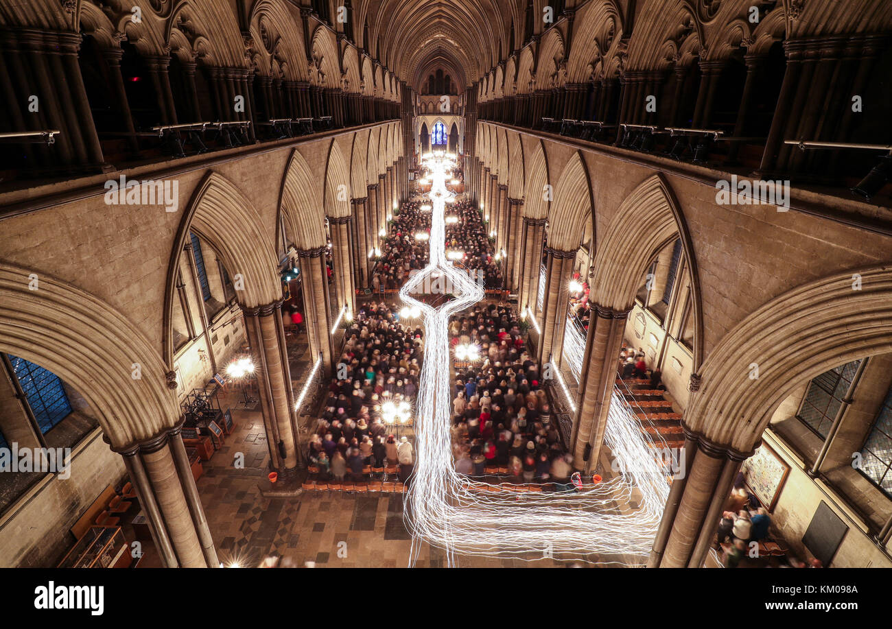 EDITORS NOTE LONG EXPOSURE Candles are carried through Salisbury ...