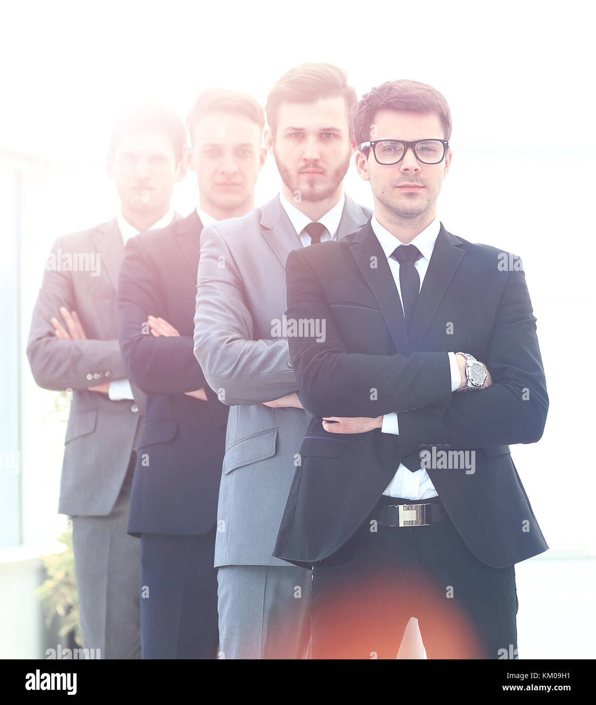 Business team in a line smiling at the camera Stock Photo - Alamy