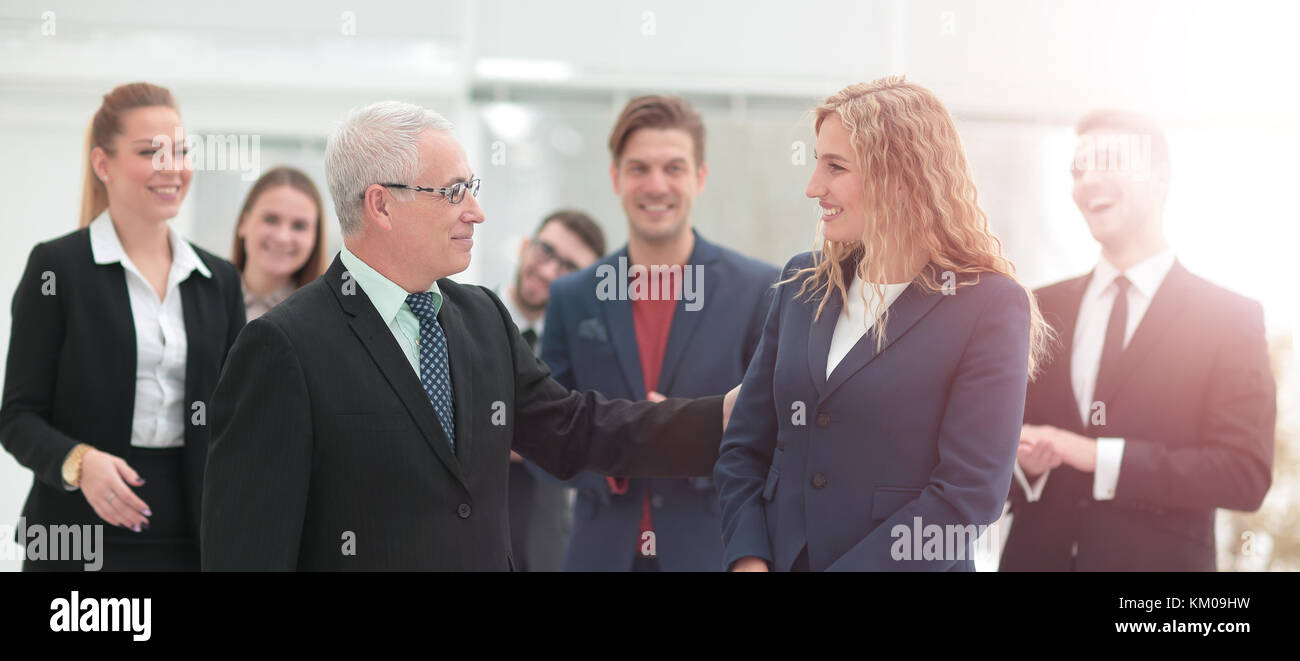 Group of happy colleagues communicating in office Stock Photo - Alamy