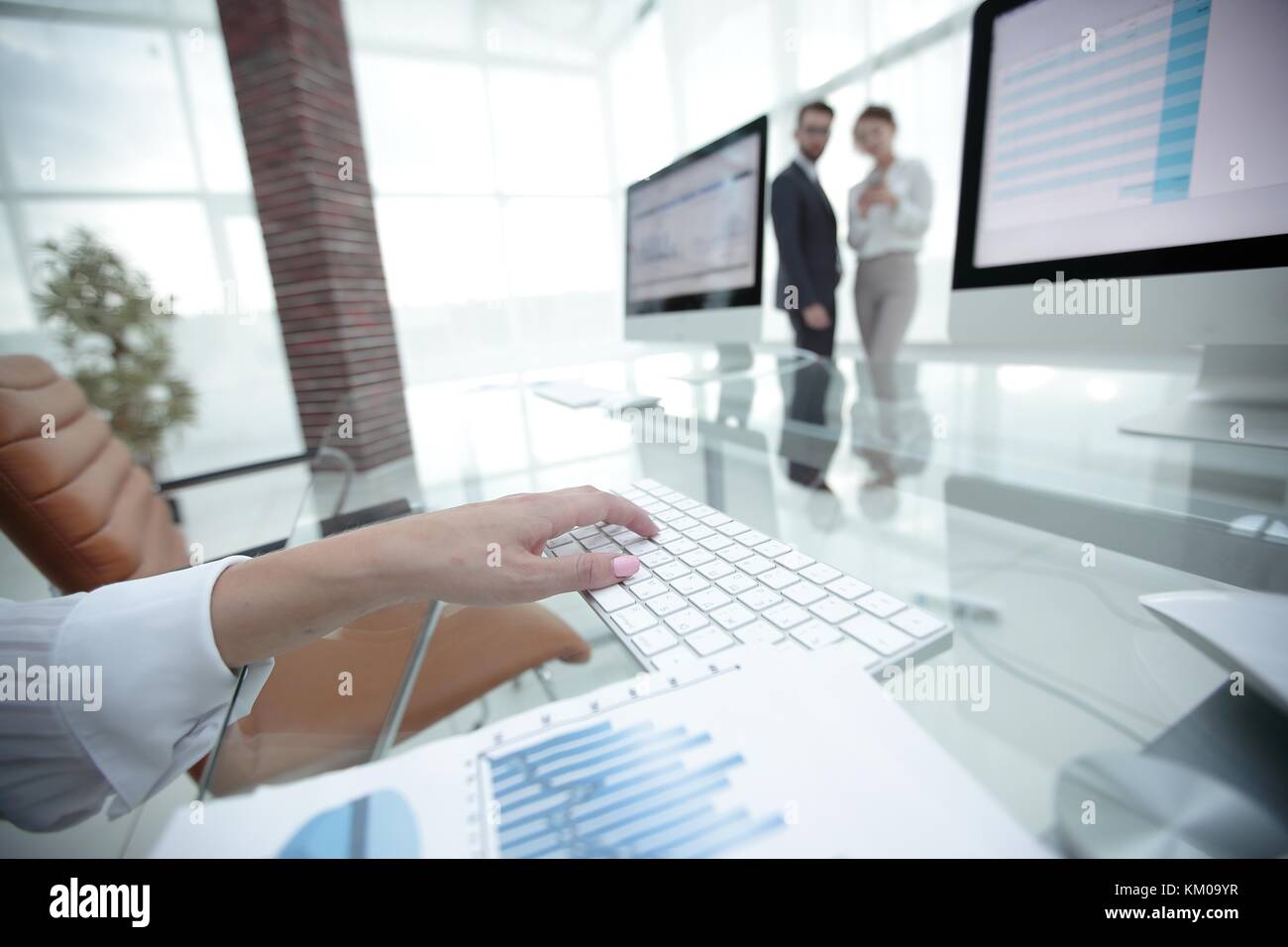 close-up of financial charts and computer keyboard on the desktop Stock ...