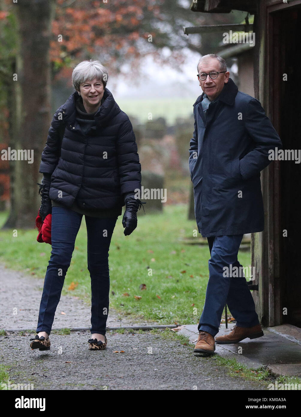 Prime Minister Theresa May and her husband Philip leave after attending ...