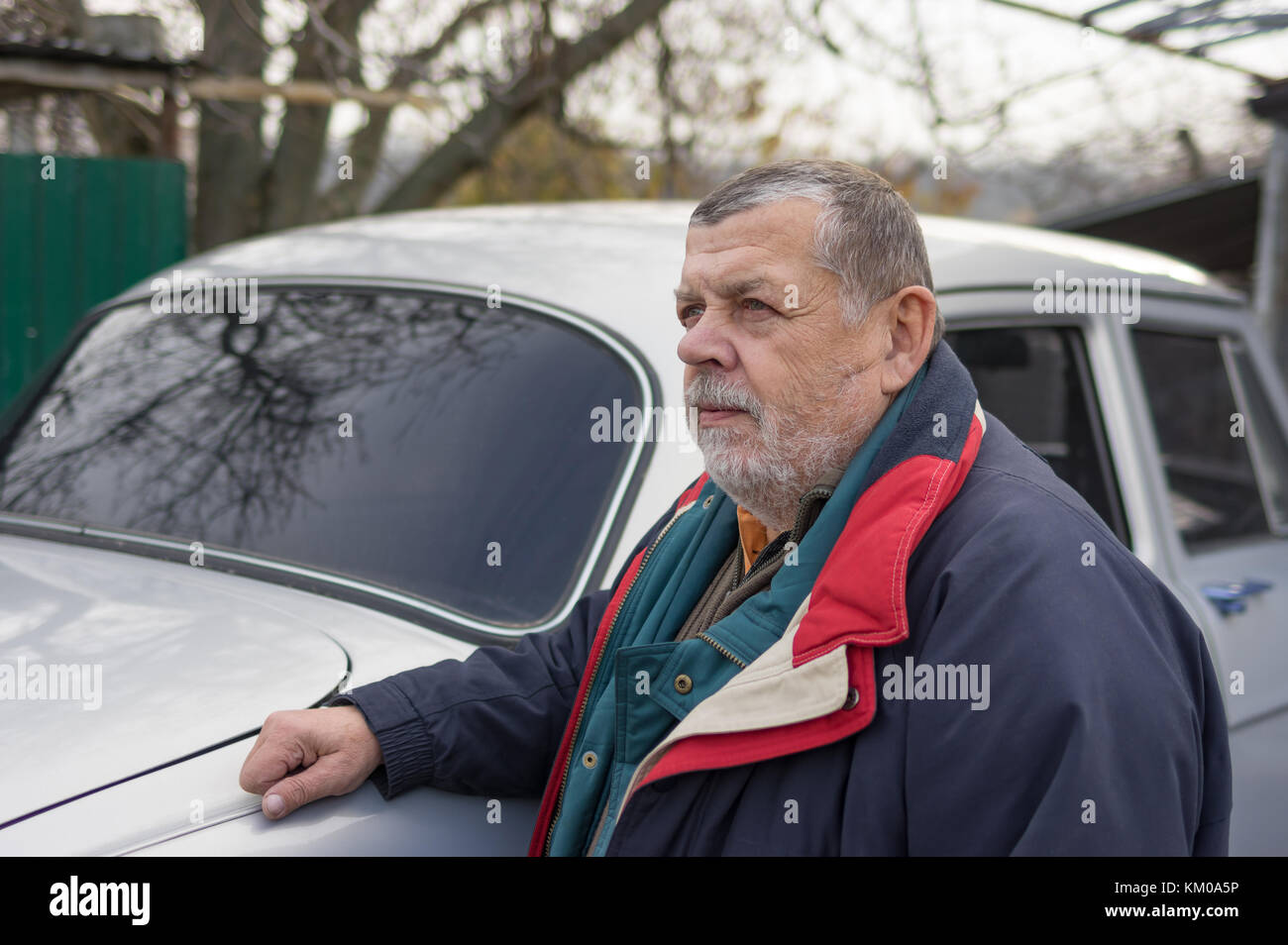 Nice portrait of senior man standing near his old car Stock Photo - Alamy