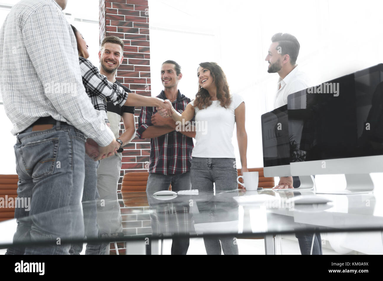 handshake of young designers and client Stock Photo - Alamy