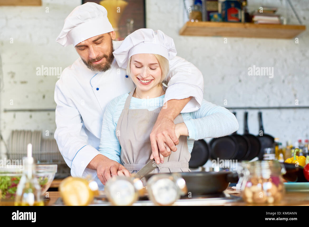 Teamwork of Professional Chef and Young Assistant Stock Photo - Alamy