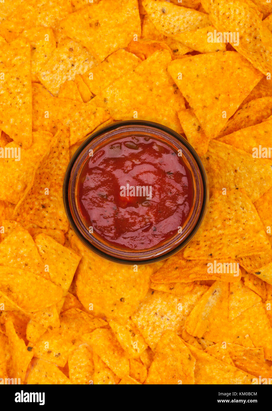 Glass container with hot pepper salsa dip nachos Stock Photo - Alamy