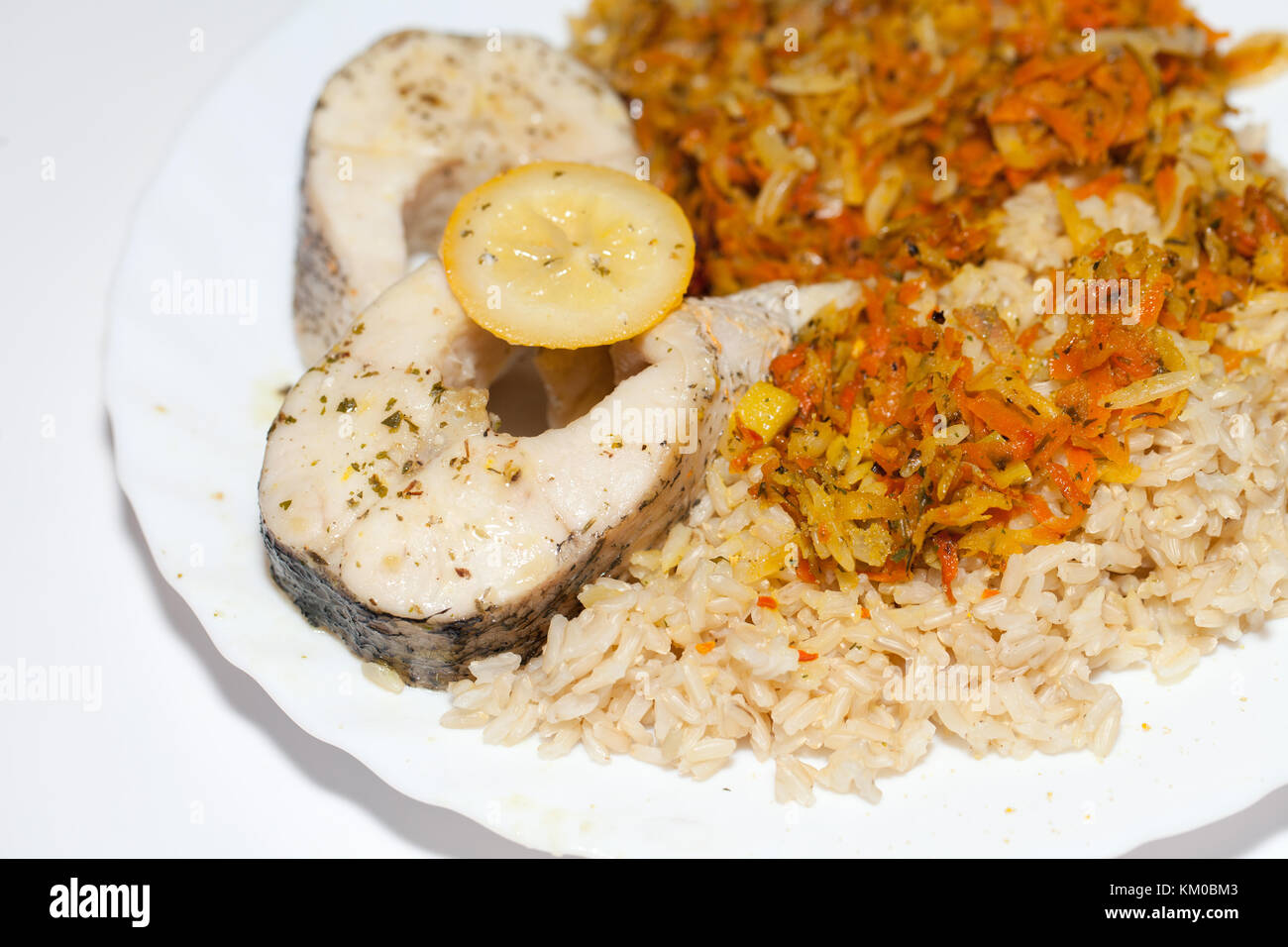 the healthy diet - brown rice with fisch and vegetable Stock Photo - Alamy