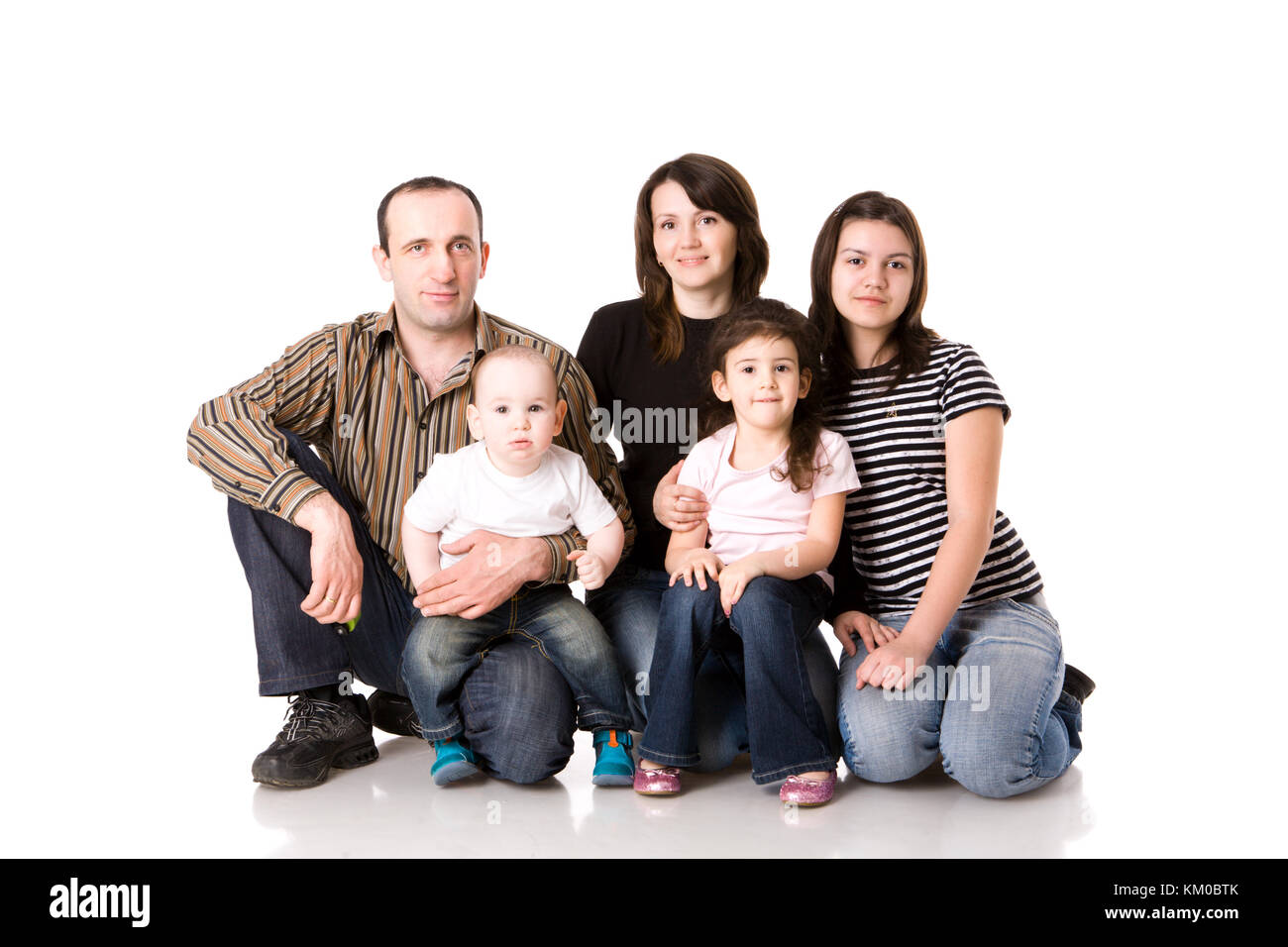 Happy Family with three kids together isolated on white Stock Photo - Alamy