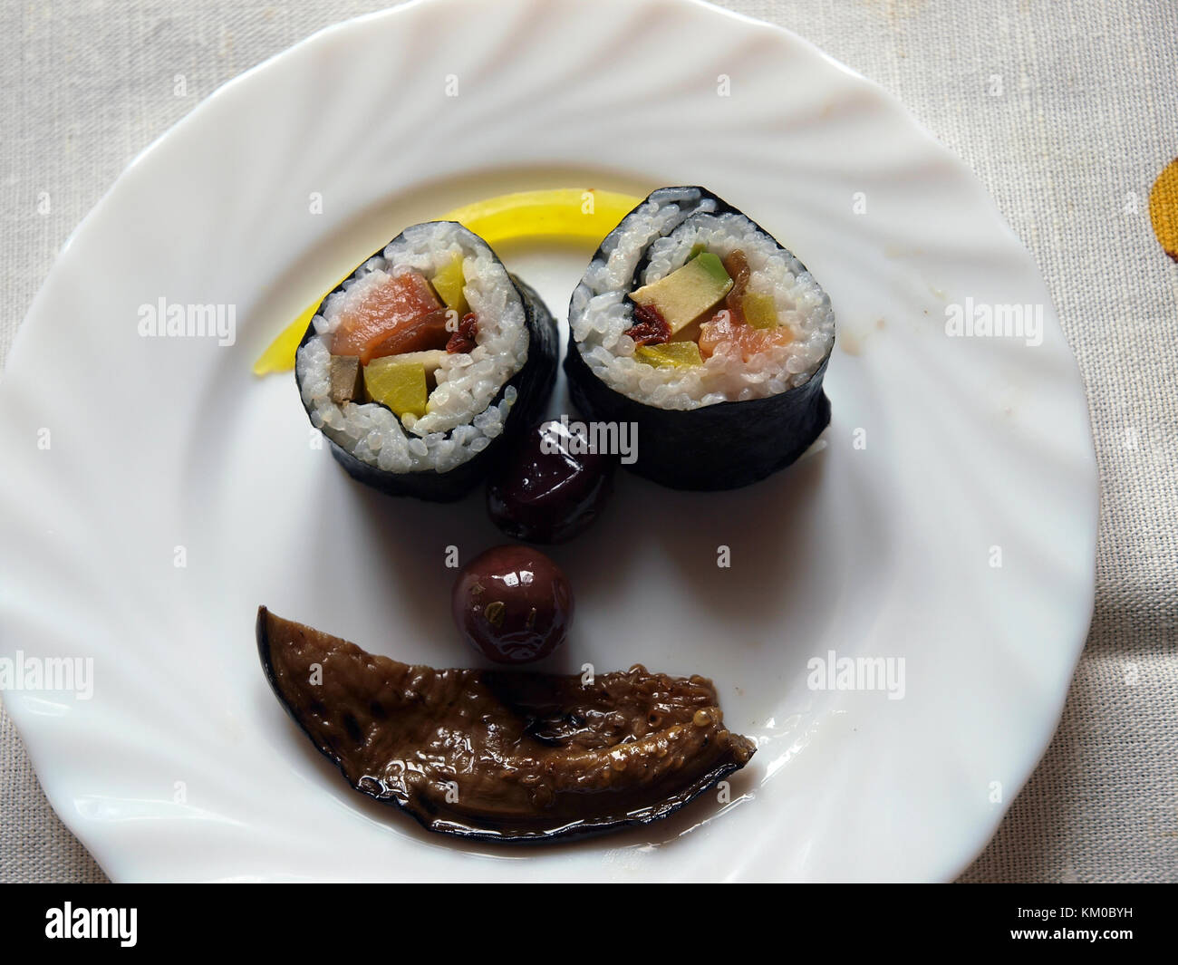 Small Rolled Sushi on a Plate Stock Photo - Alamy