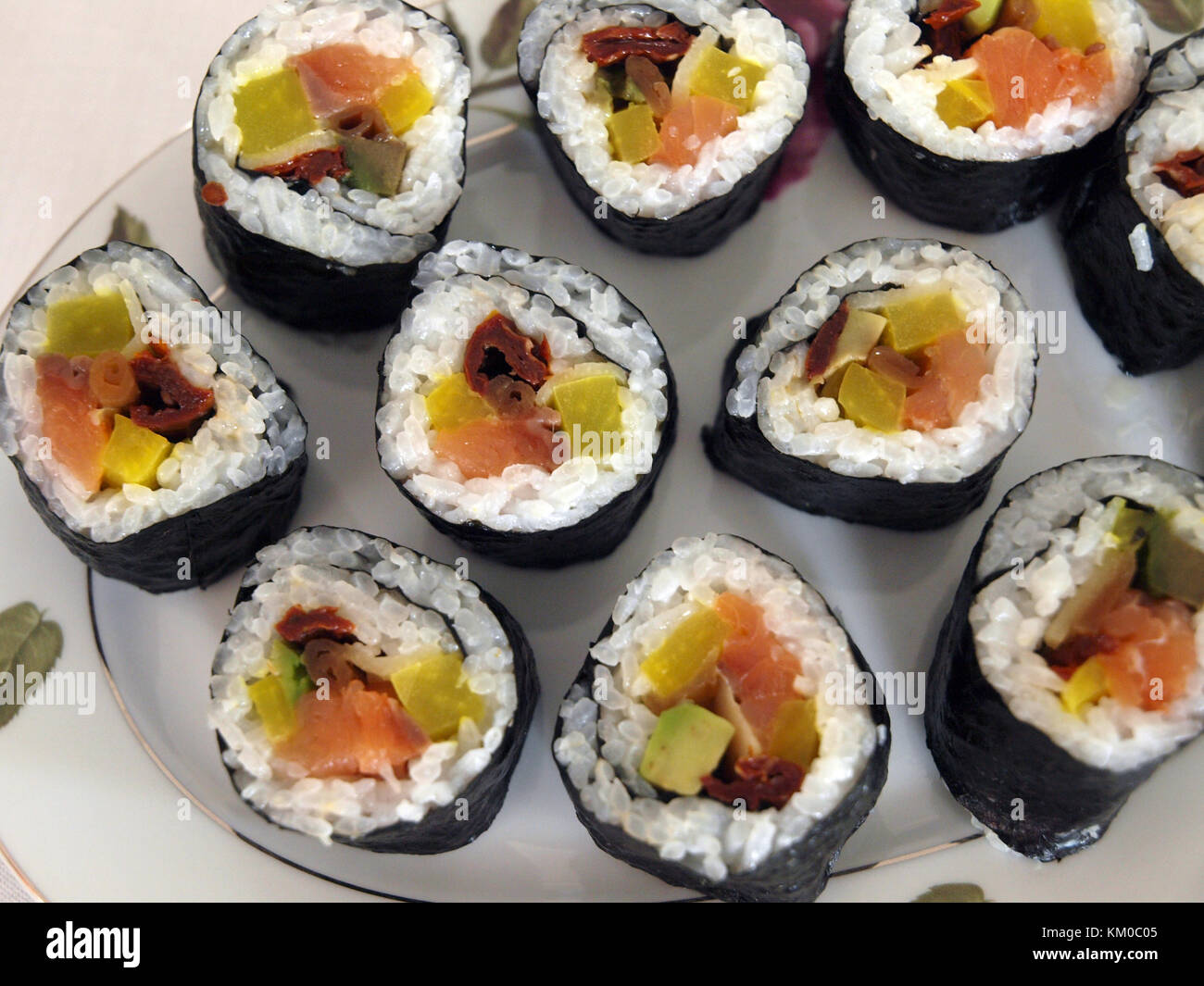 Small Rolled Sushi on a Plate Stock Photo - Alamy
