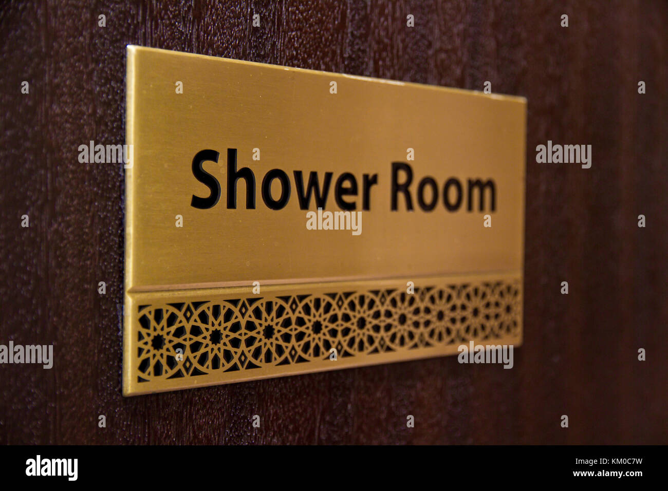 Golden shower room sign Stock Photo - Alamy