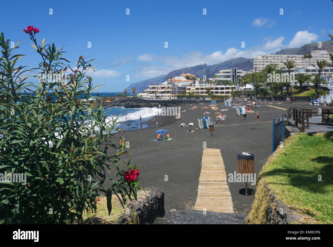 Playa La Arena, dark beach at the village La Arena, west coast ...