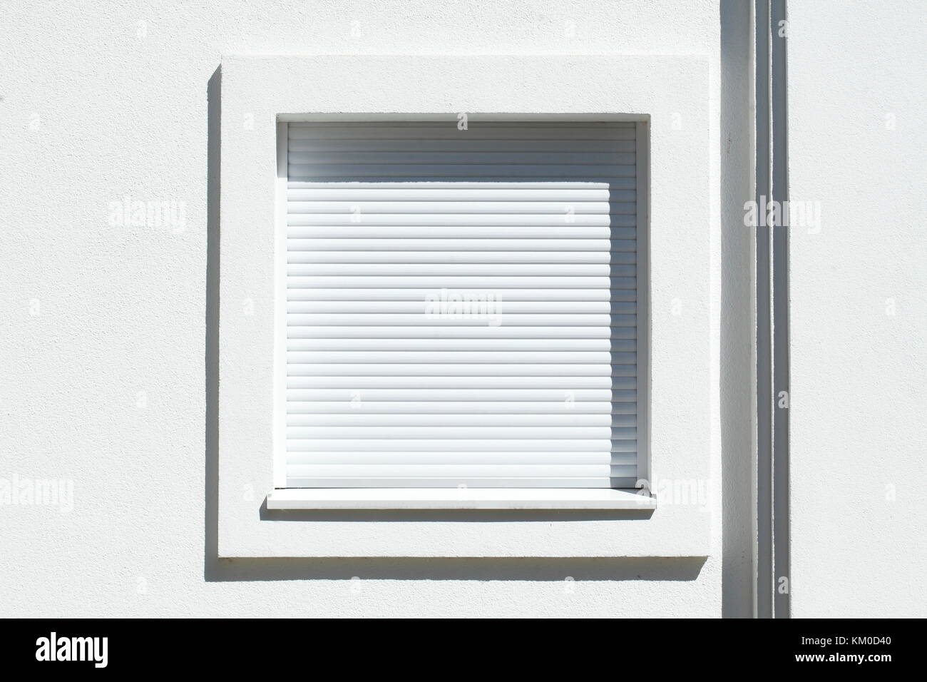 White Plastic Window with pulled down shutters Stock Photo - Alamy