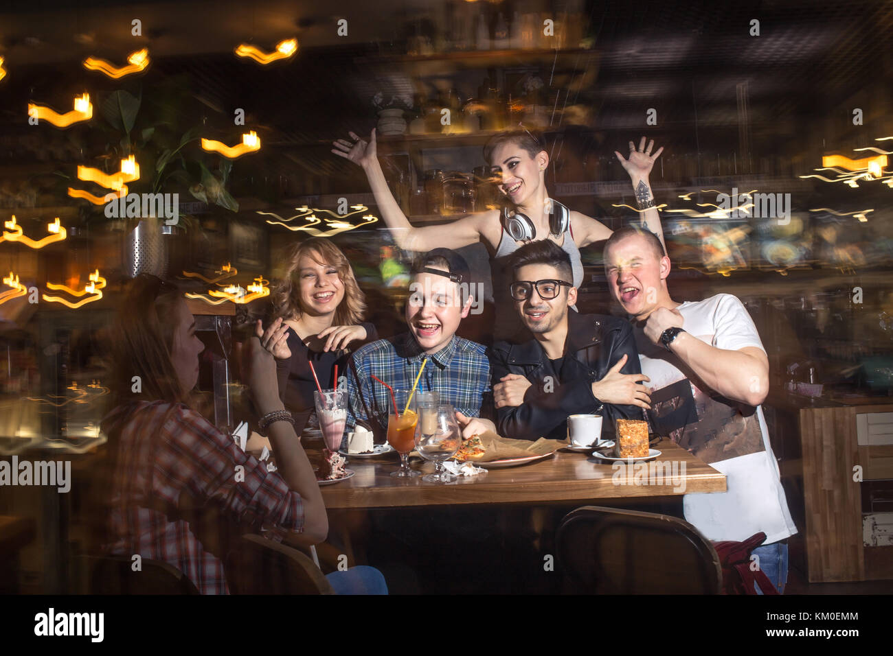 friends having fun and drinking beer in night club. long exposure Stock ...