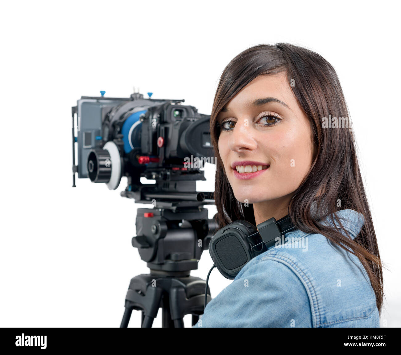 a beautiful young woman with DSLR video camera and headphones Stock ...
