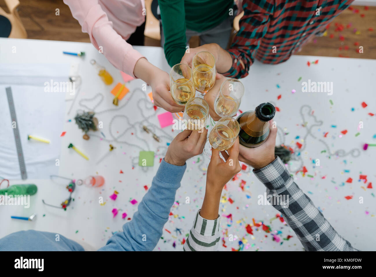 Rasing their glasses at office party Stock Photo - Alamy