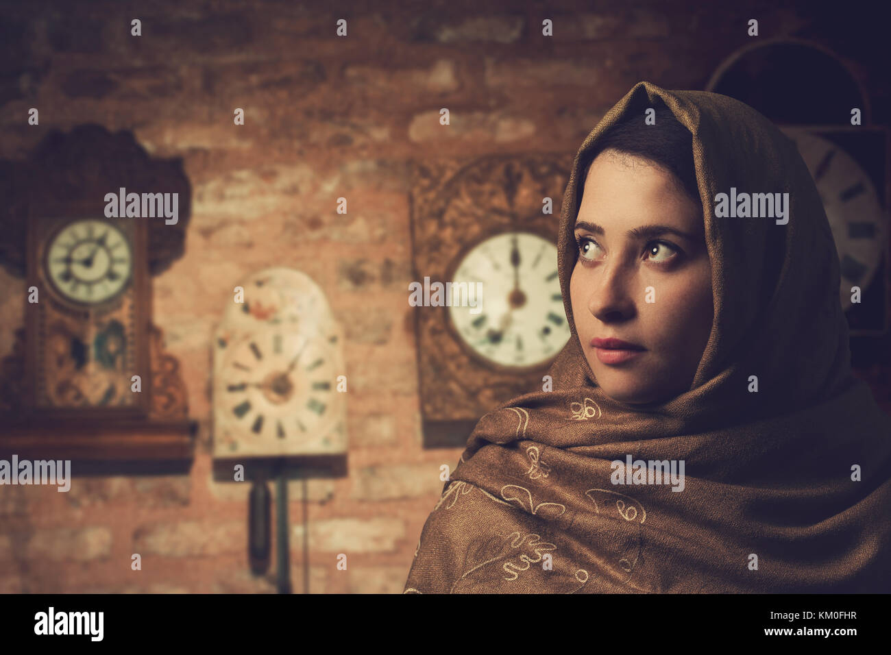 Young beautiful woman and old clocks on wall.Time concept Stock Photo ...