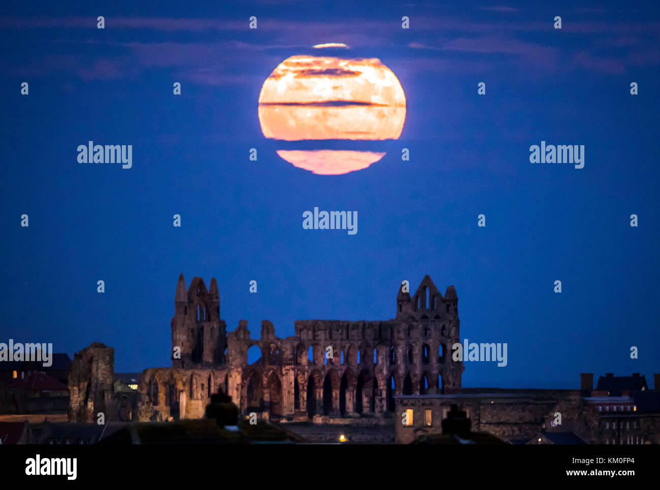 The Supermoon rises above Whitby Abbey in Yorkshire Stock Photo - Alamy