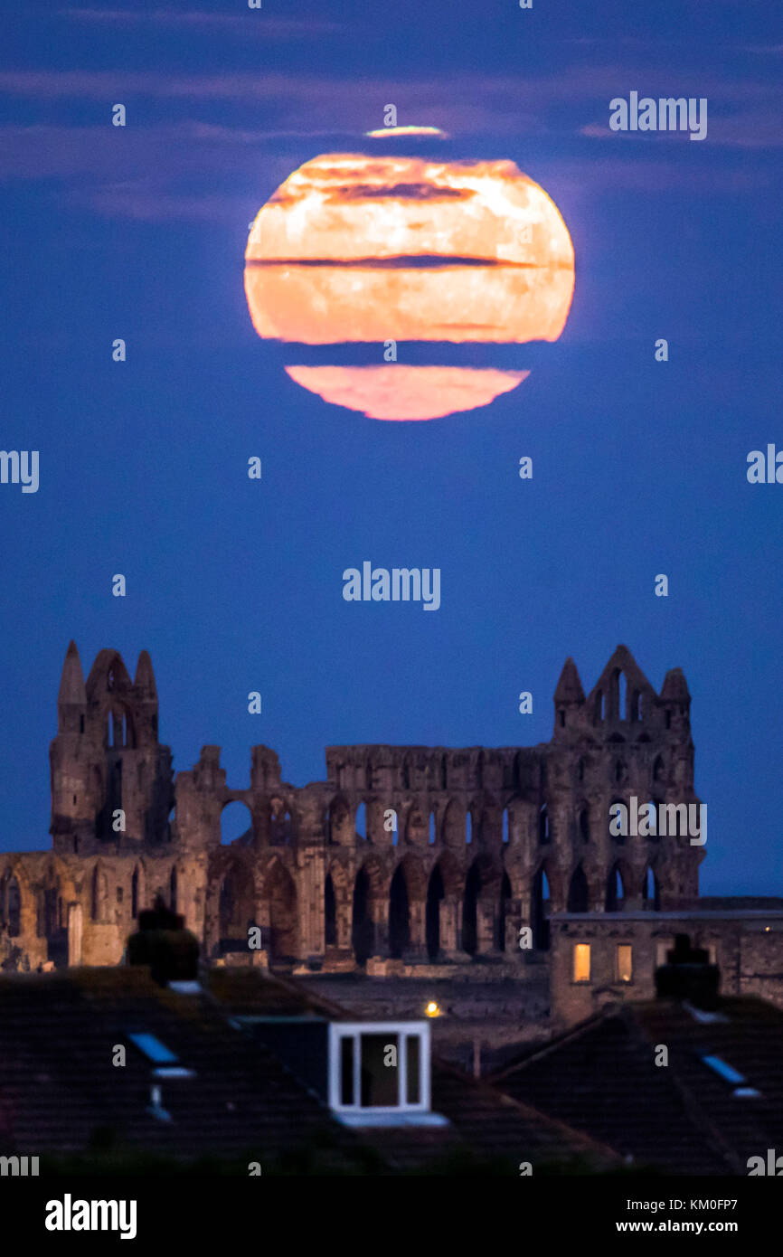 The Supermoon rises above Whitby Abbey in Yorkshire Stock Photo - Alamy
