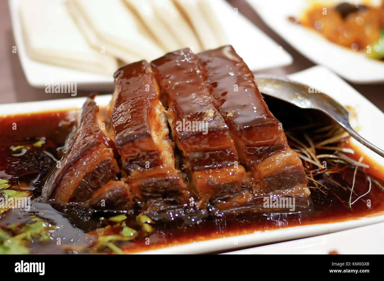 Close up of preserved vegetables with layer pork on plate with steam ...