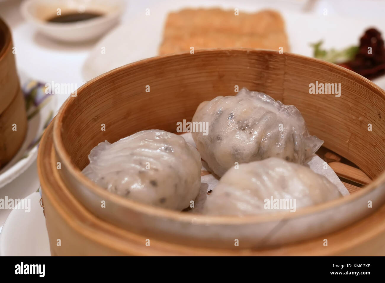 Close up vof steamed prawn dumplings with steam on table Stock Photo ...