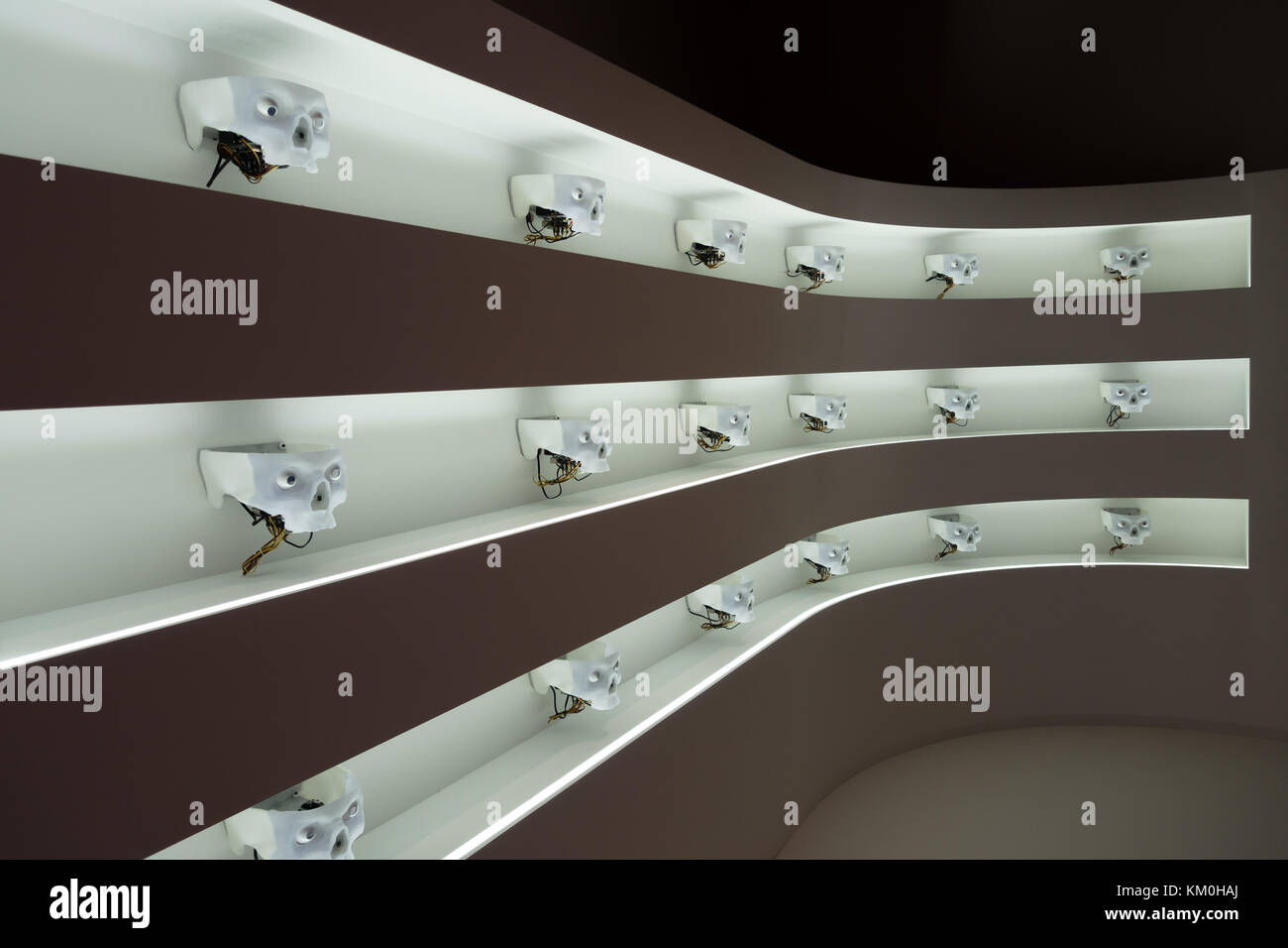 Rows of futuristic robotic human skull face staring at the camera with ...