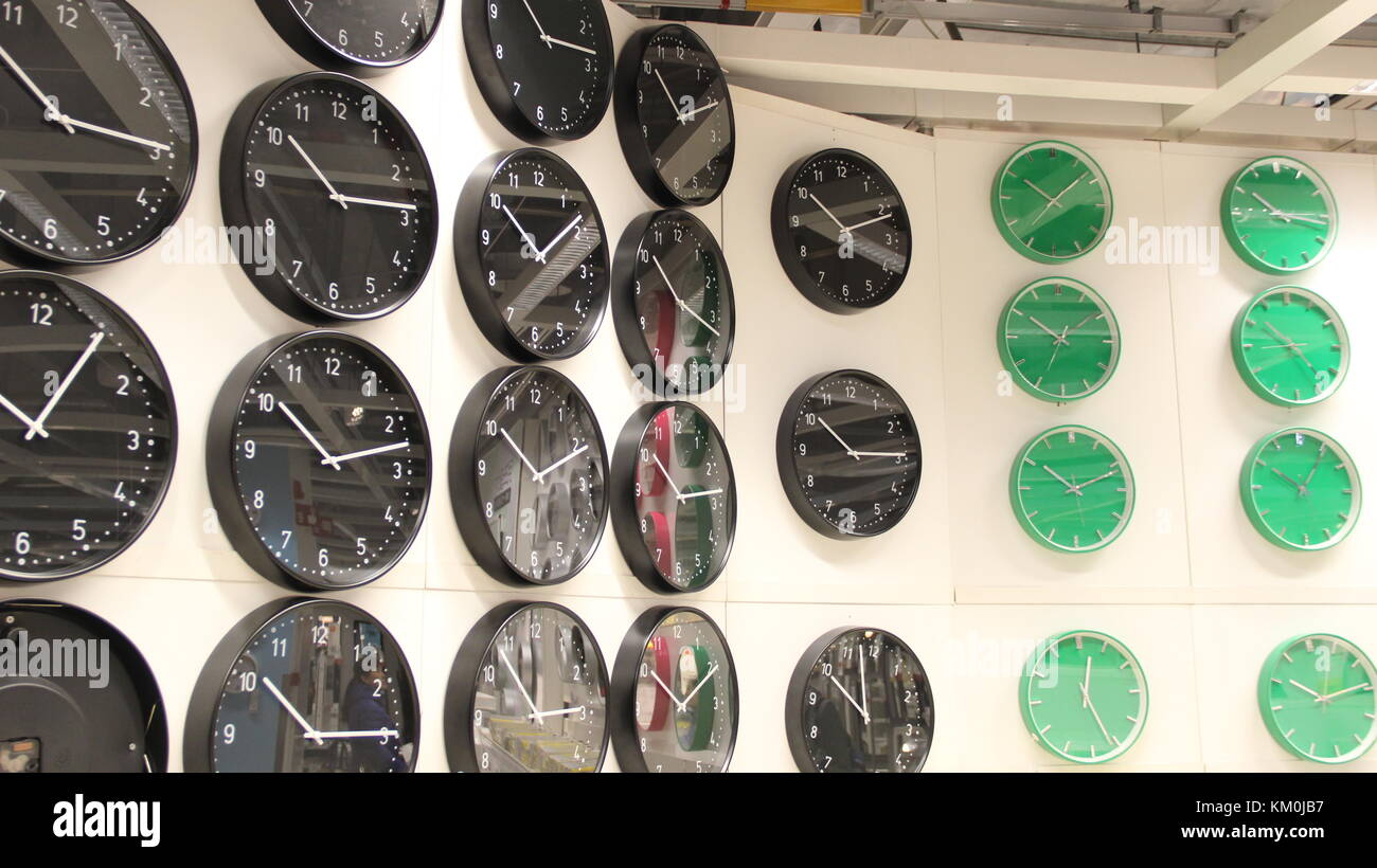 Clocks on a wall Stock Photo - Alamy