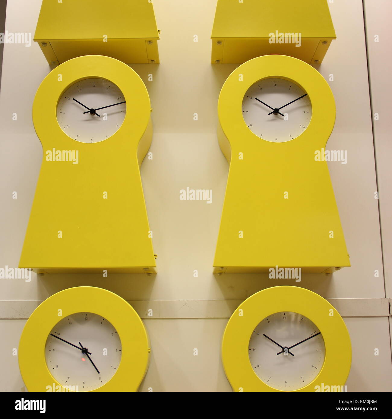 Clocks on a wall Stock Photo - Alamy