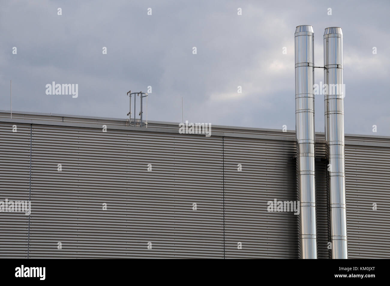 steel chimneys at metal facade Stock Photo - Alamy