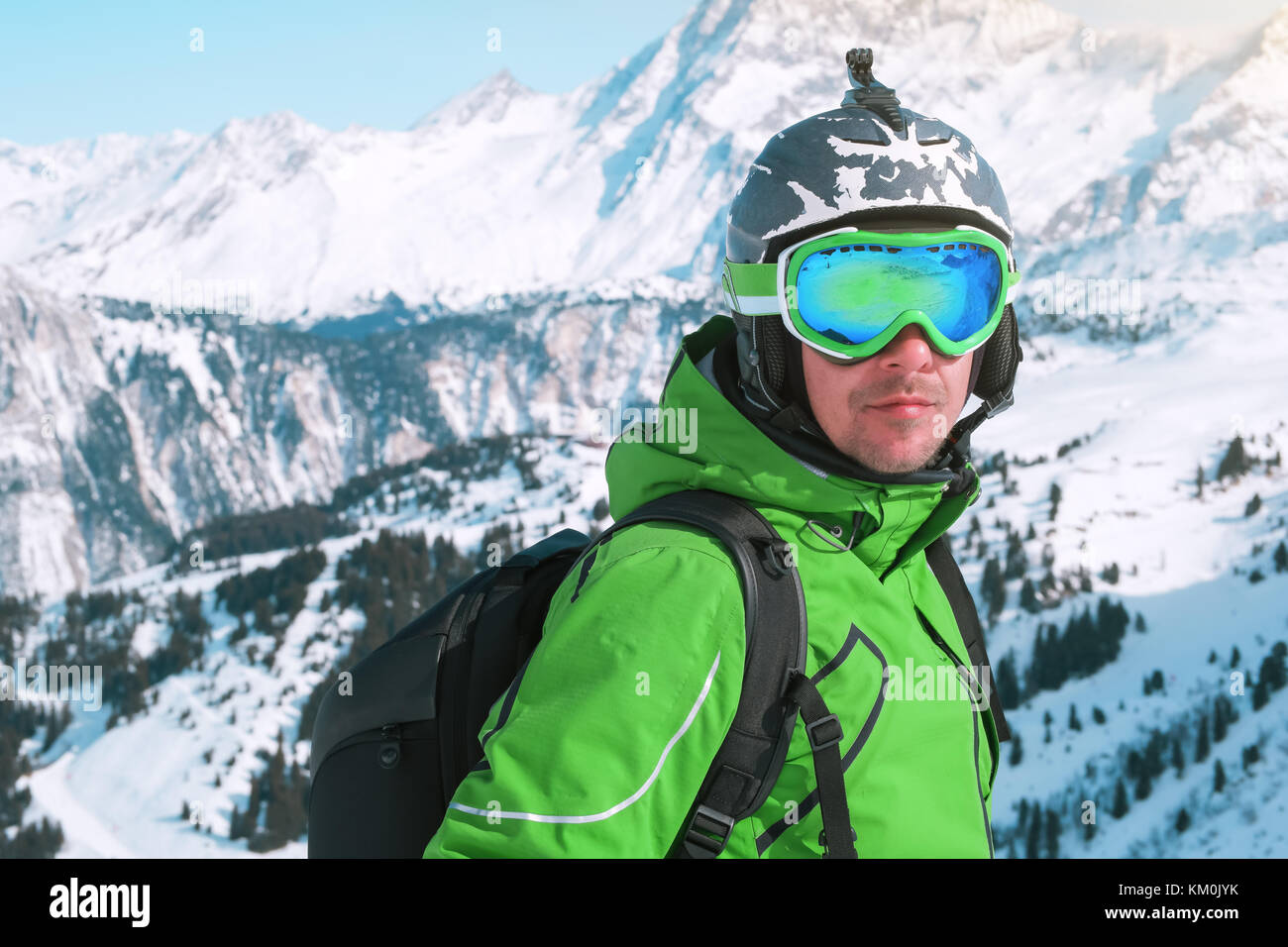 Skiing, portrait of happy male skier on top of mountain Stock Photo - Alamy