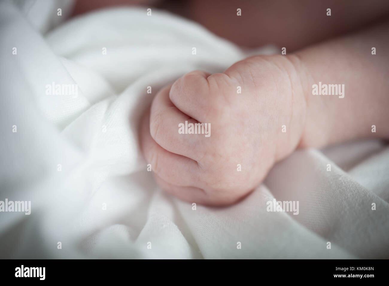 Hand the sleeping baby in the hand of mother close-up Stock Photo - Alamy