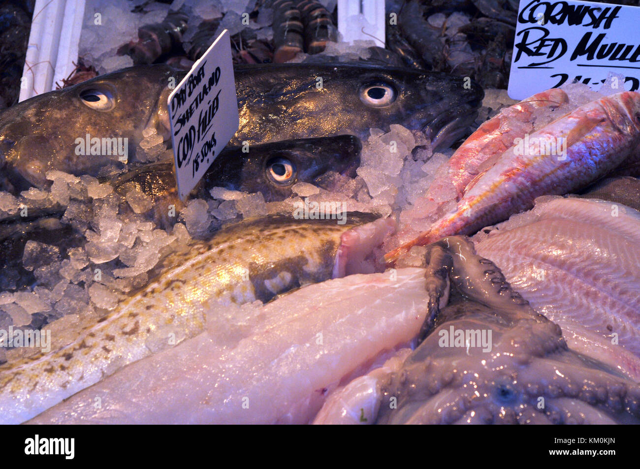 A variety of fresh wet fish for sale at a fishmongers stall on Borough ...