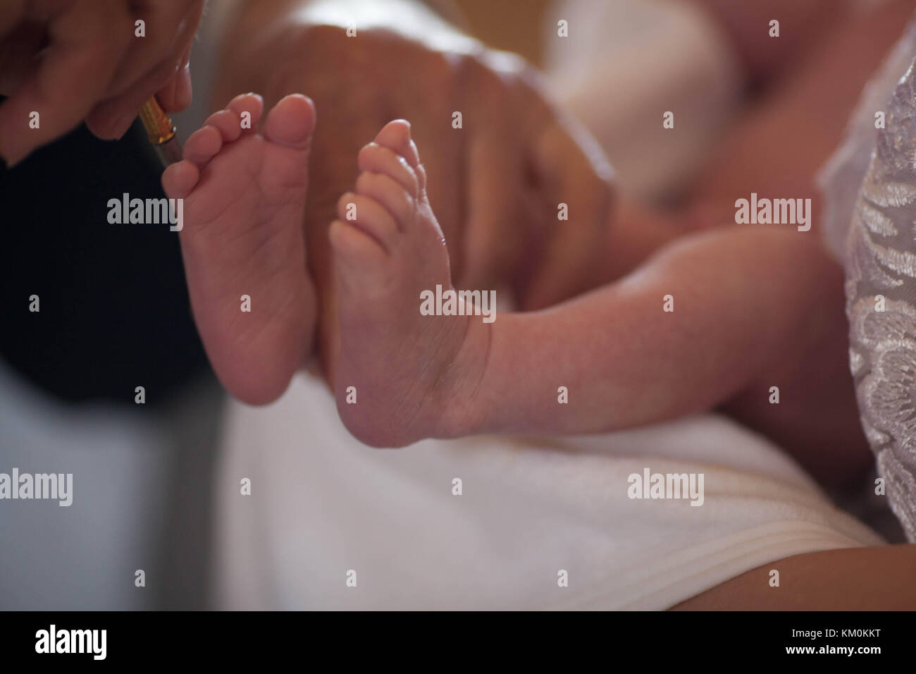 Feet of baby close up. Childish legs on blurred background Stock Photo ...