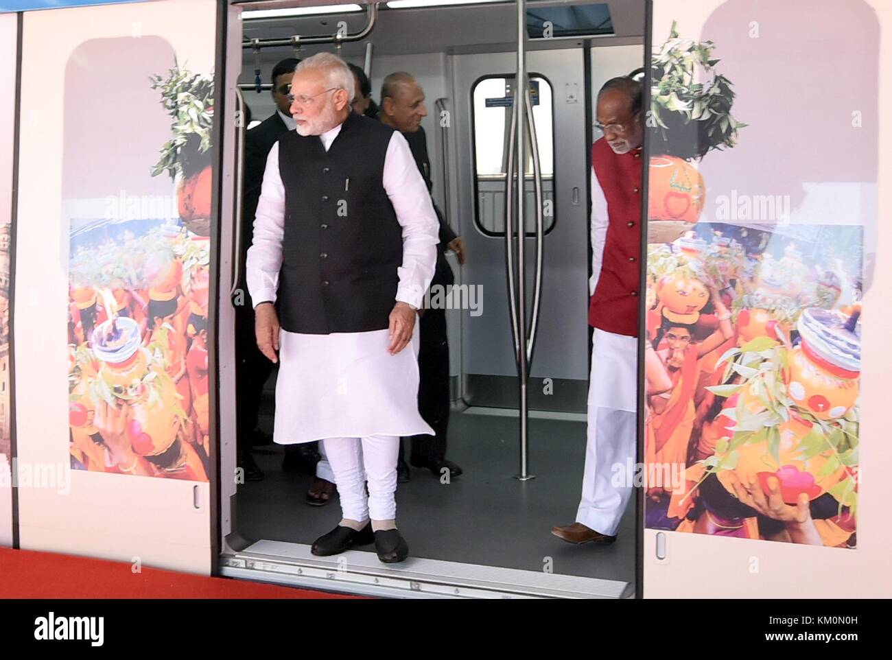 Indian Prime Minister Narendra Modi, steps off a metro car during the ...