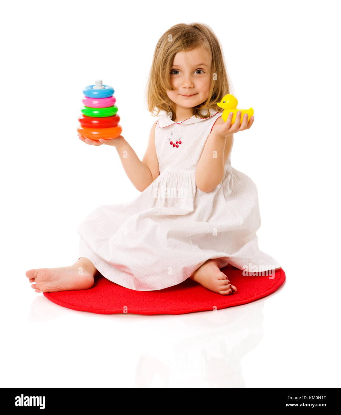 little girl playing with pyramid isolated on white Stock Photo - Alamy