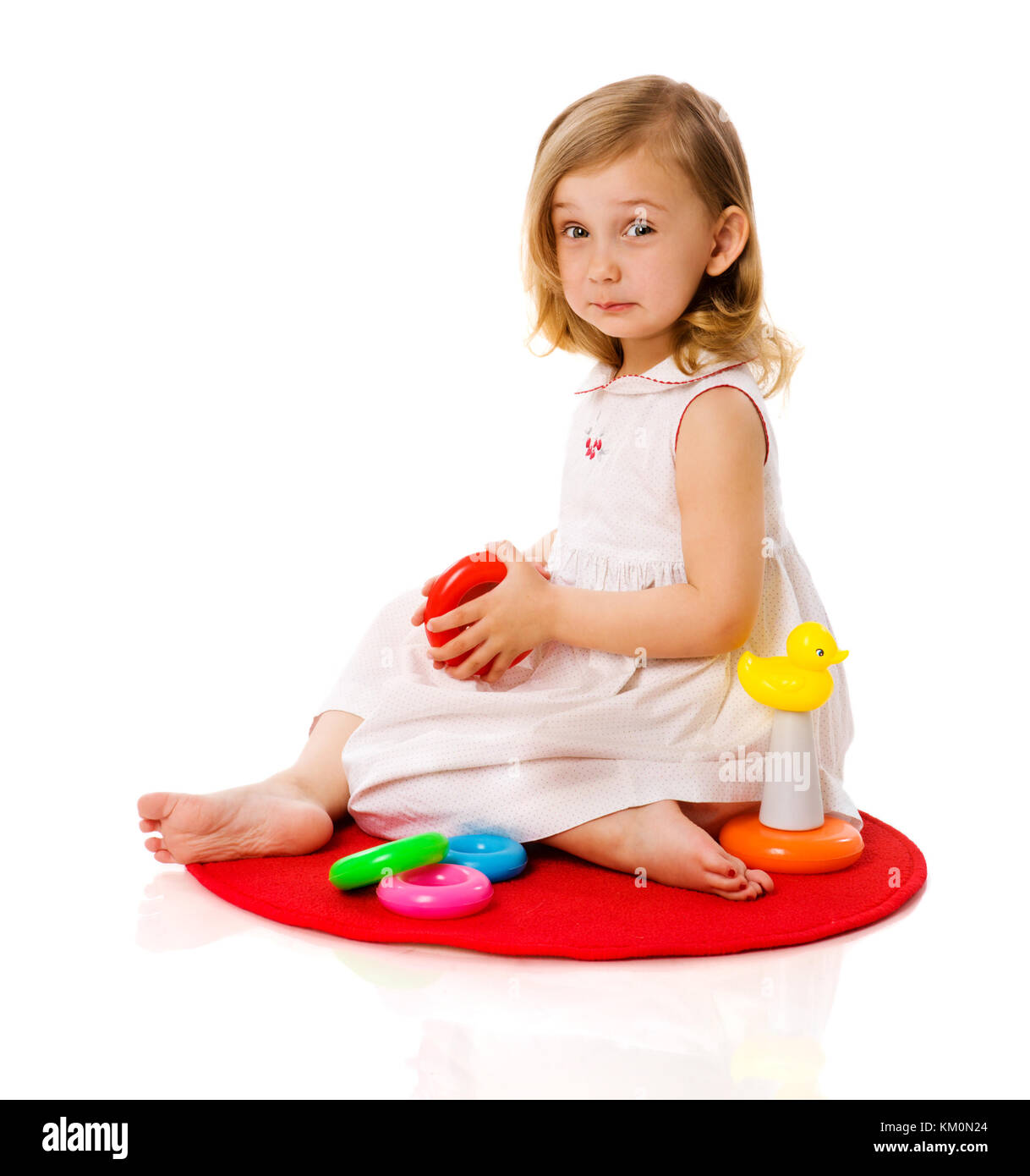 little girl playing with pyramid isolated on white Stock Photo - Alamy