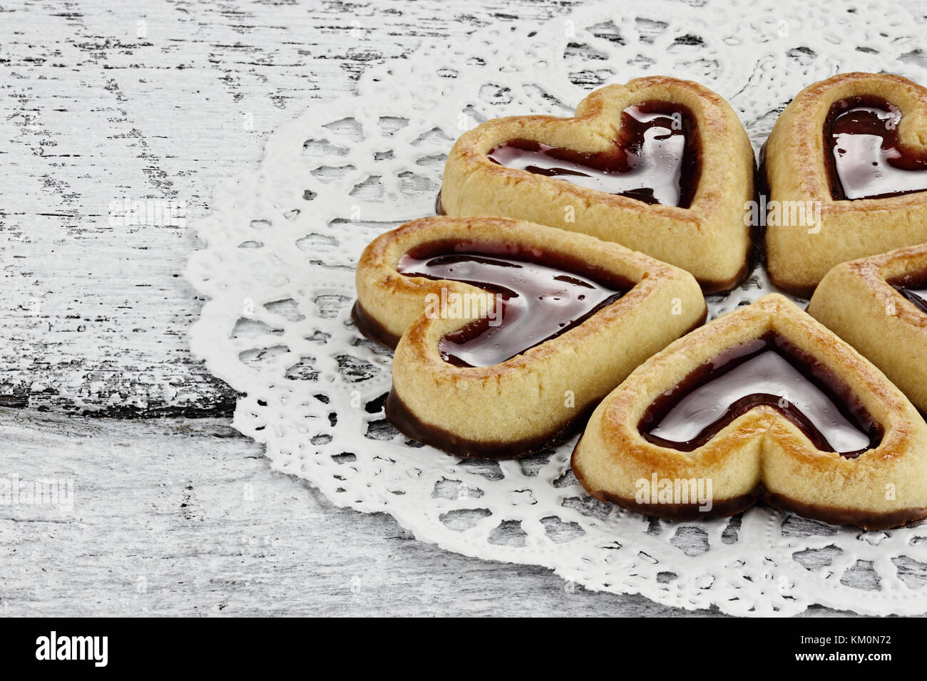 Heart shaped shortbread cookies in a circle on a rustic background ...