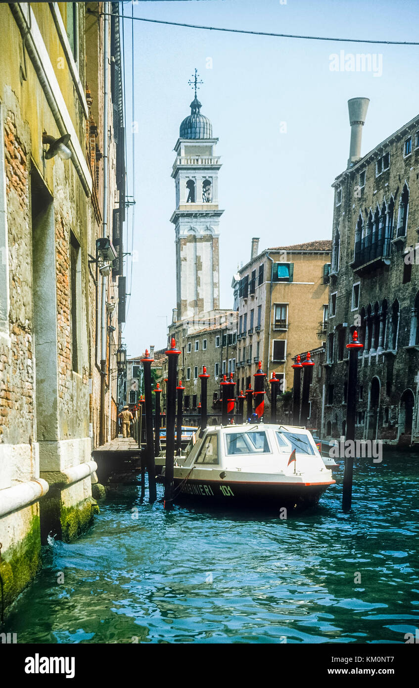 Police launch in narrow Venice canal Stock Photo - Alamy