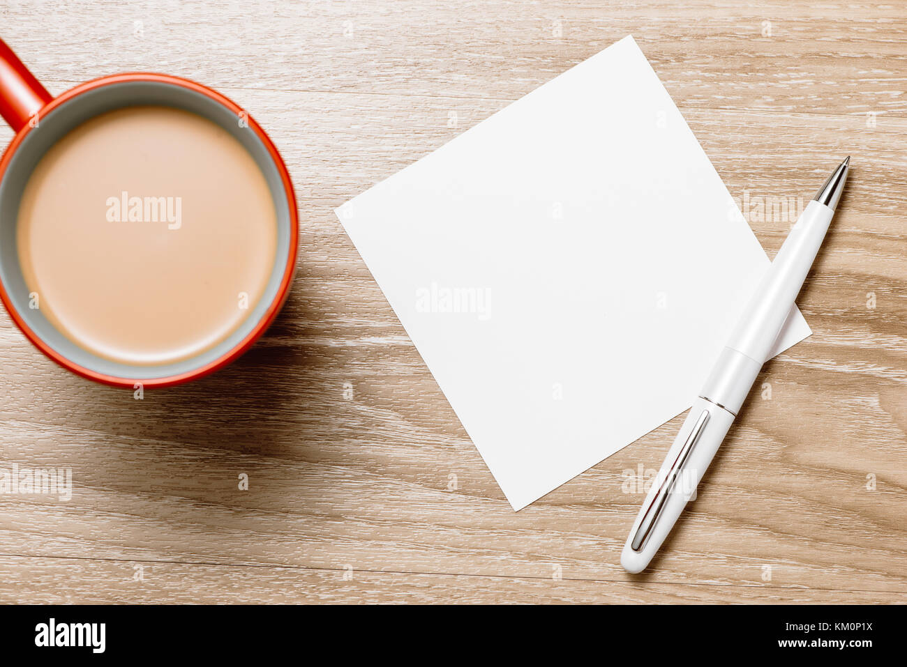 Blank paper and cup of coffee on the desk Stock Photo - Alamy