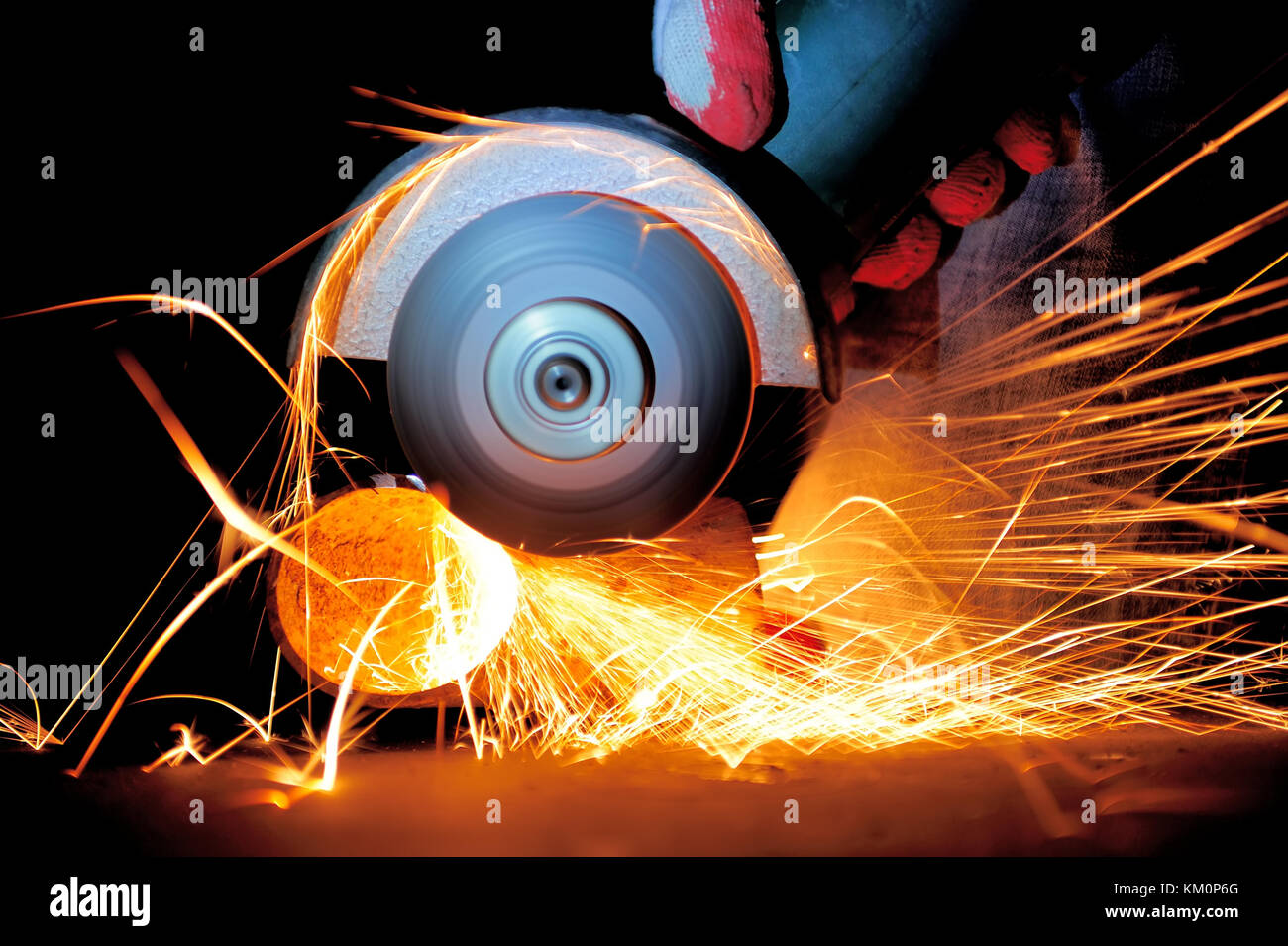 Worker cutting metal with grinder. Sparks while grinding iron Stock ...