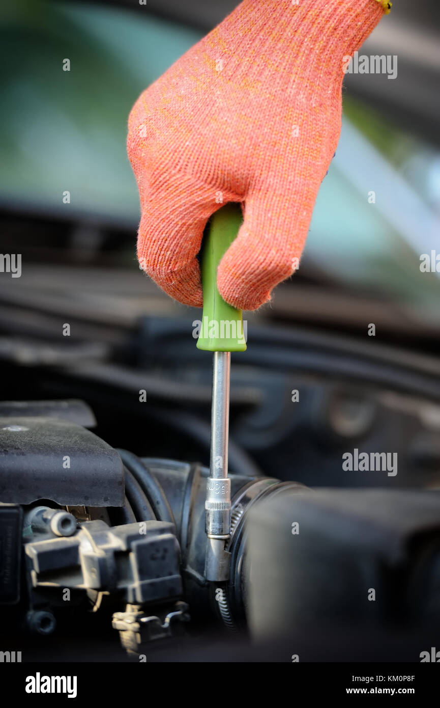 Hands of car mechanic in auto repair service Stock Photo - Alamy