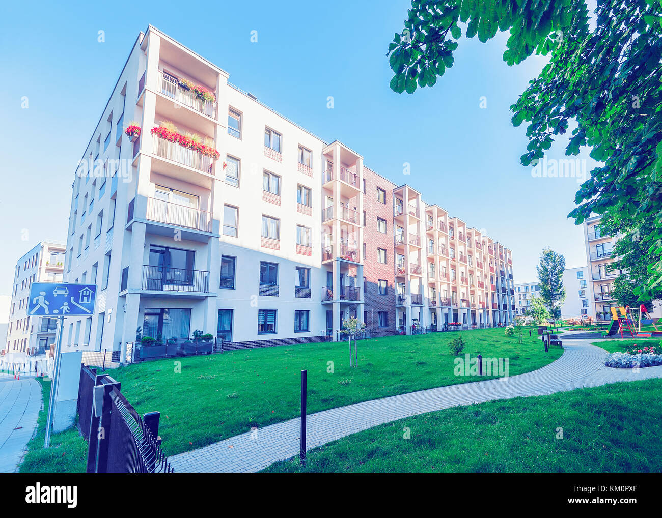Complex of new apartment building with children playground as outdoor ...