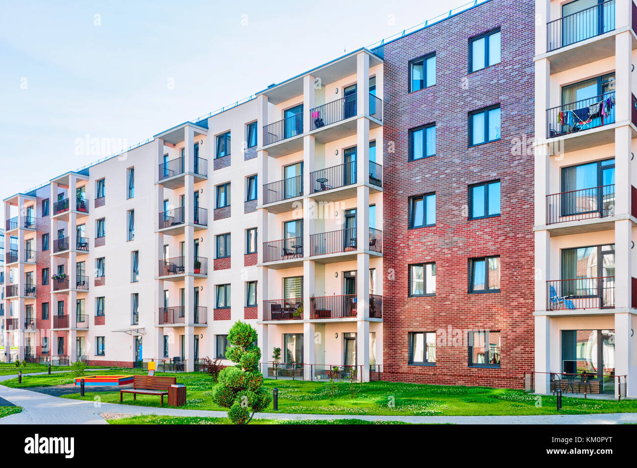 Complex of new apartment buildings with flower plants and outdoor ...