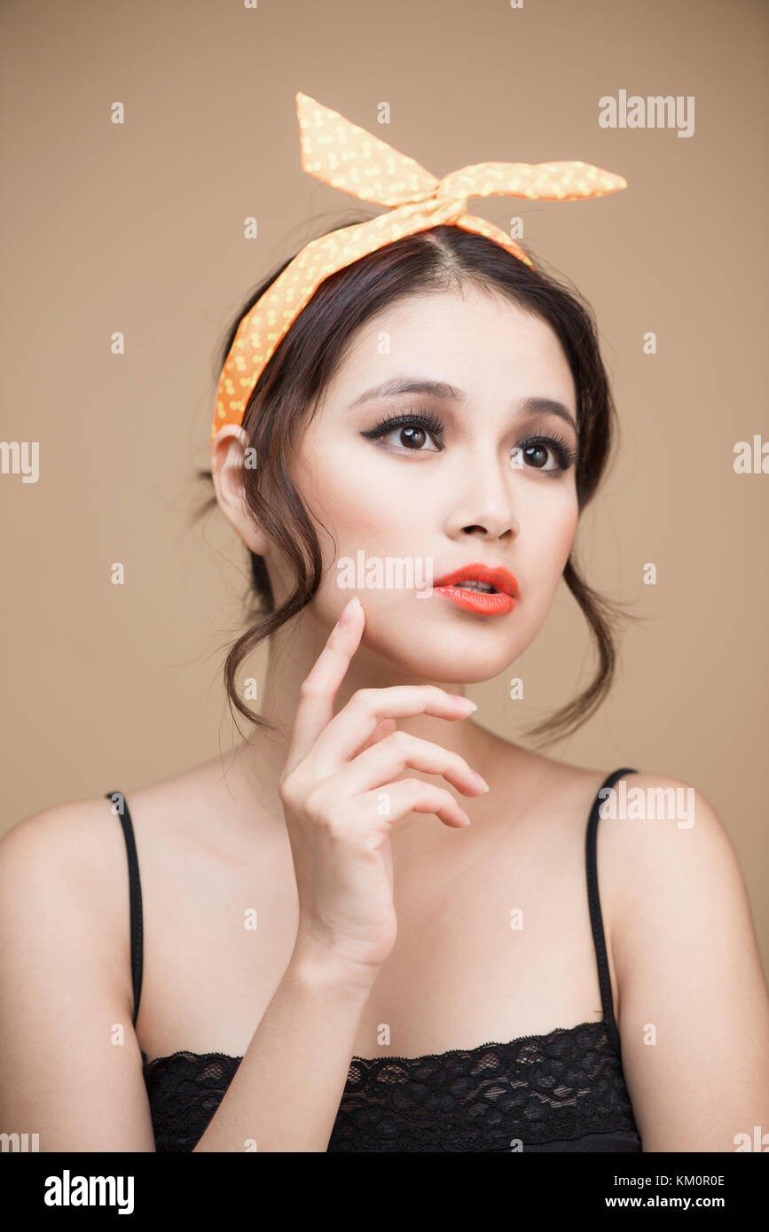 Beautiful woman pinup style portrait. Asian woman Stock Photo - Alamy