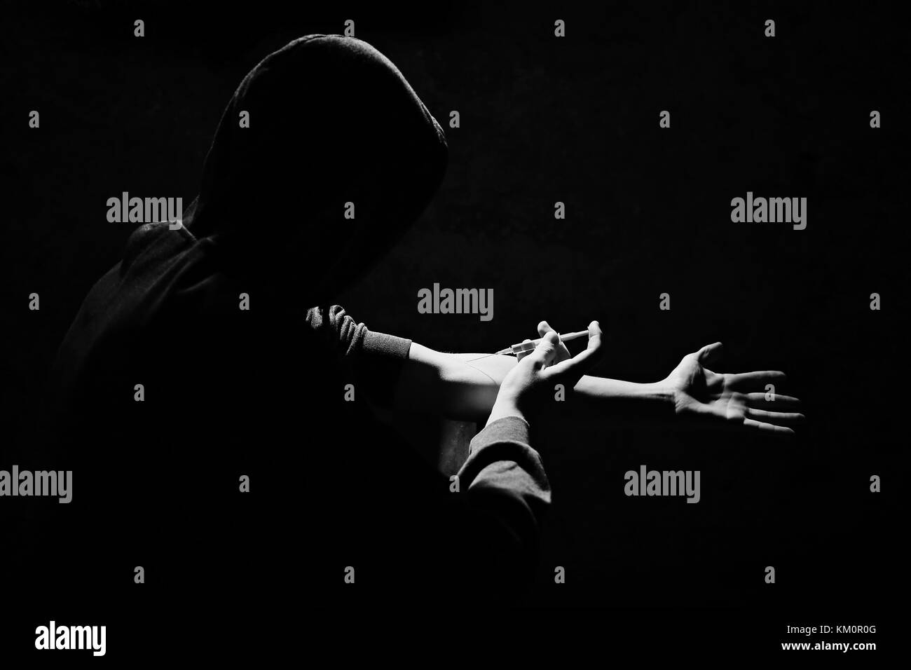 Drugs concept. Disease concept. Drug addict man with syringe using ...