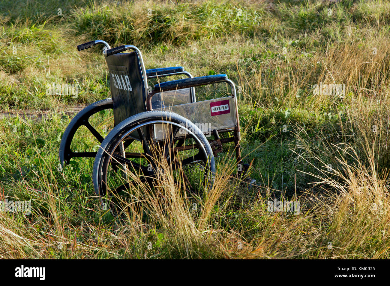 Abandoned wheelchair resting in destroyed housing complex, resulting ...