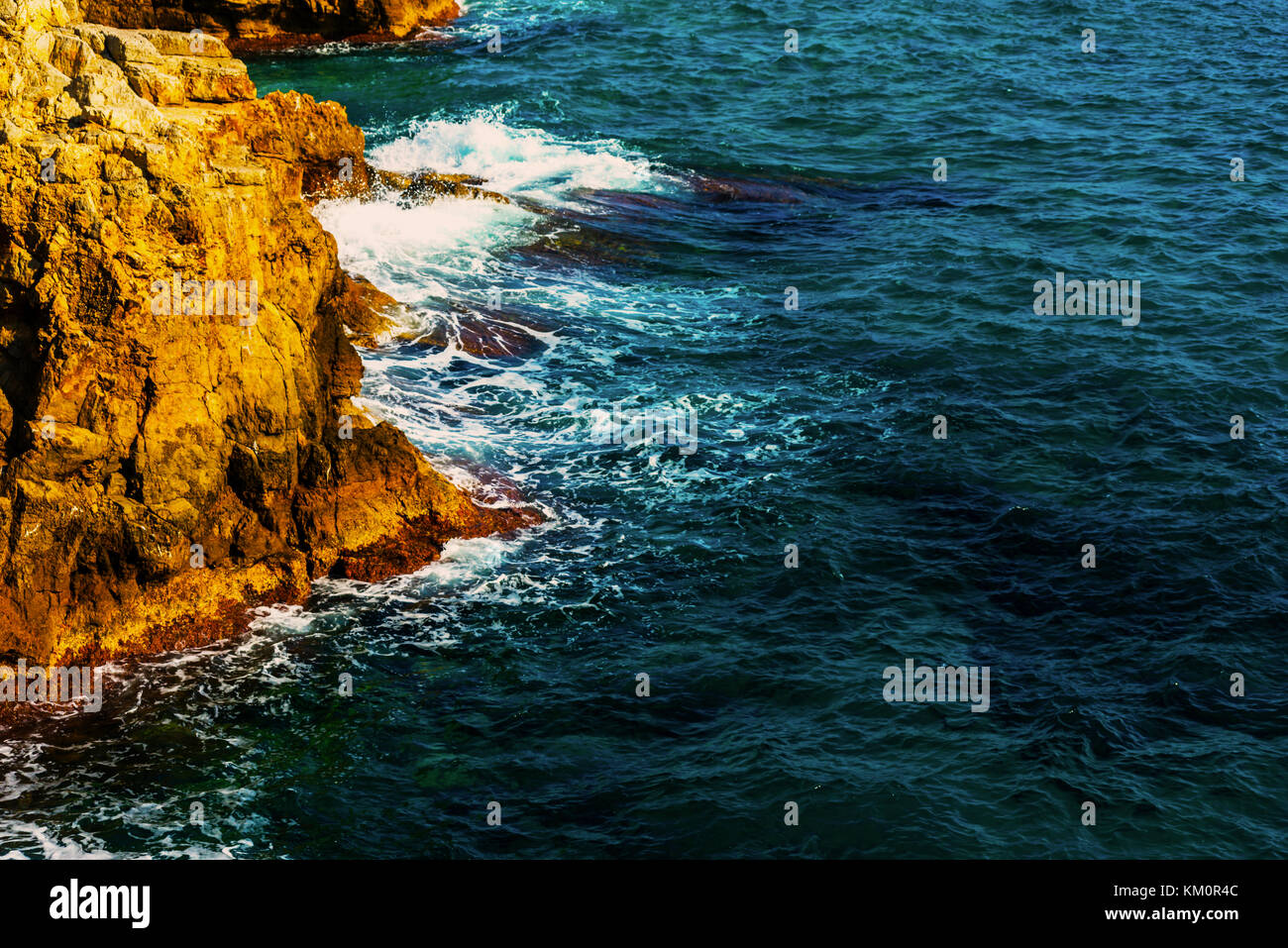 high cliff above the sea, summer sea background, many splashing waves ...