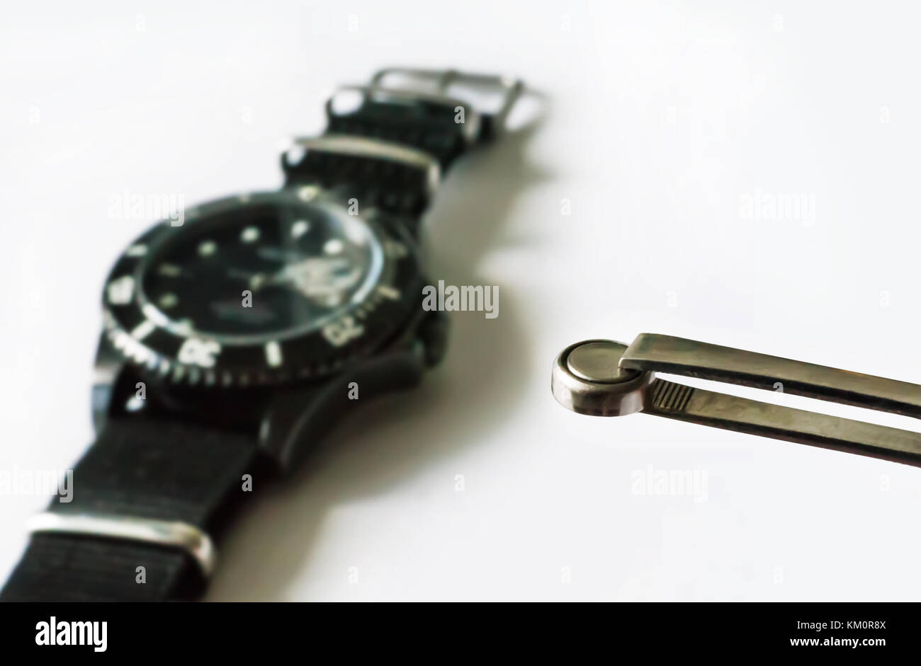 watch battery replacement, watchmaker replacing watch battery on quartz ...