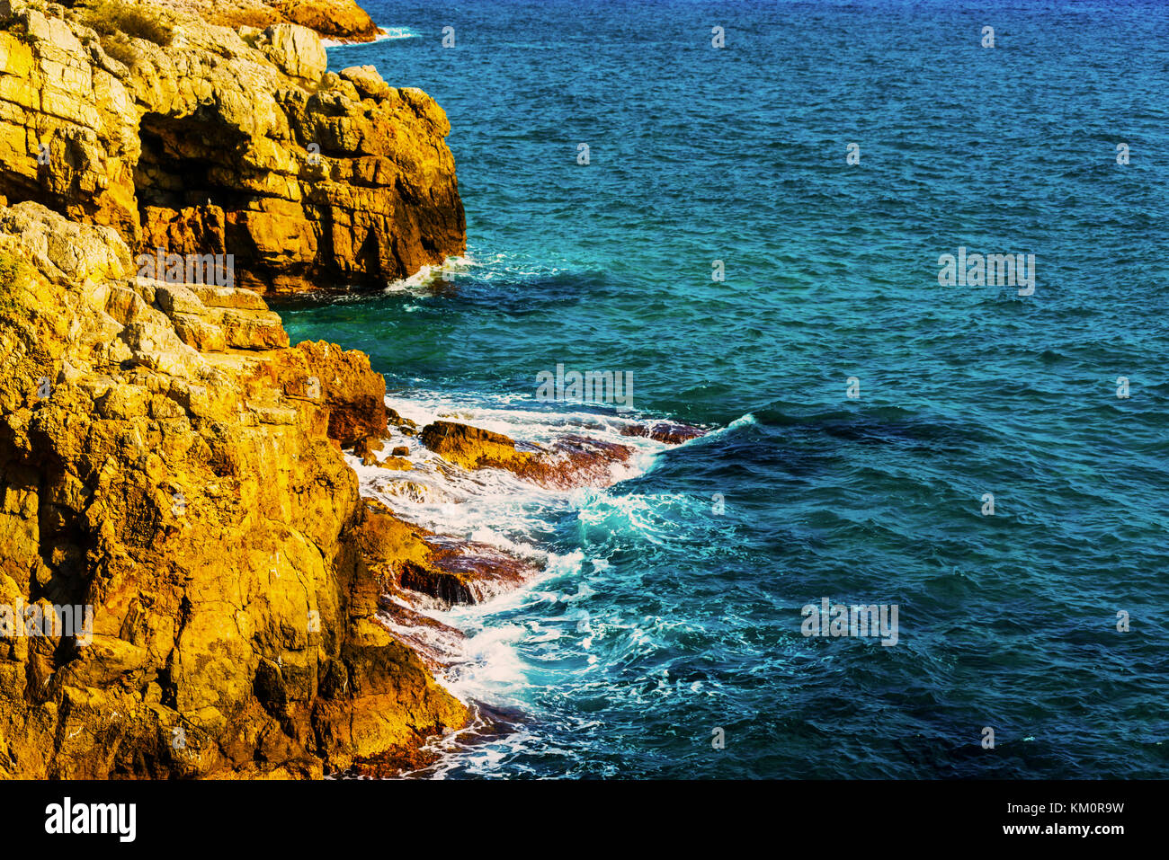 high cliff above the sea, summer sea background, many splashing waves ...